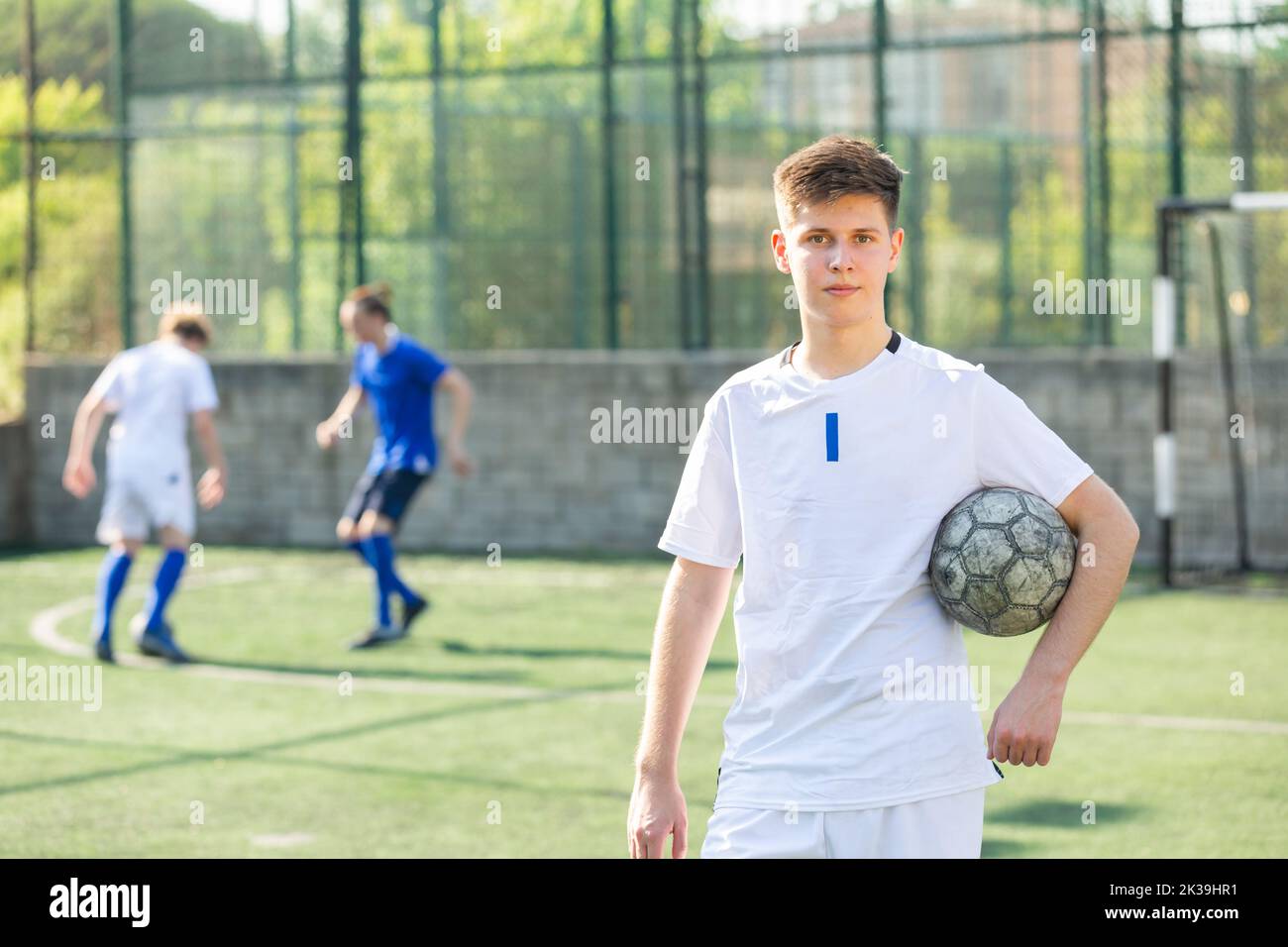 Boy standing on lawn football hi-res stock photography and images - Alamy
