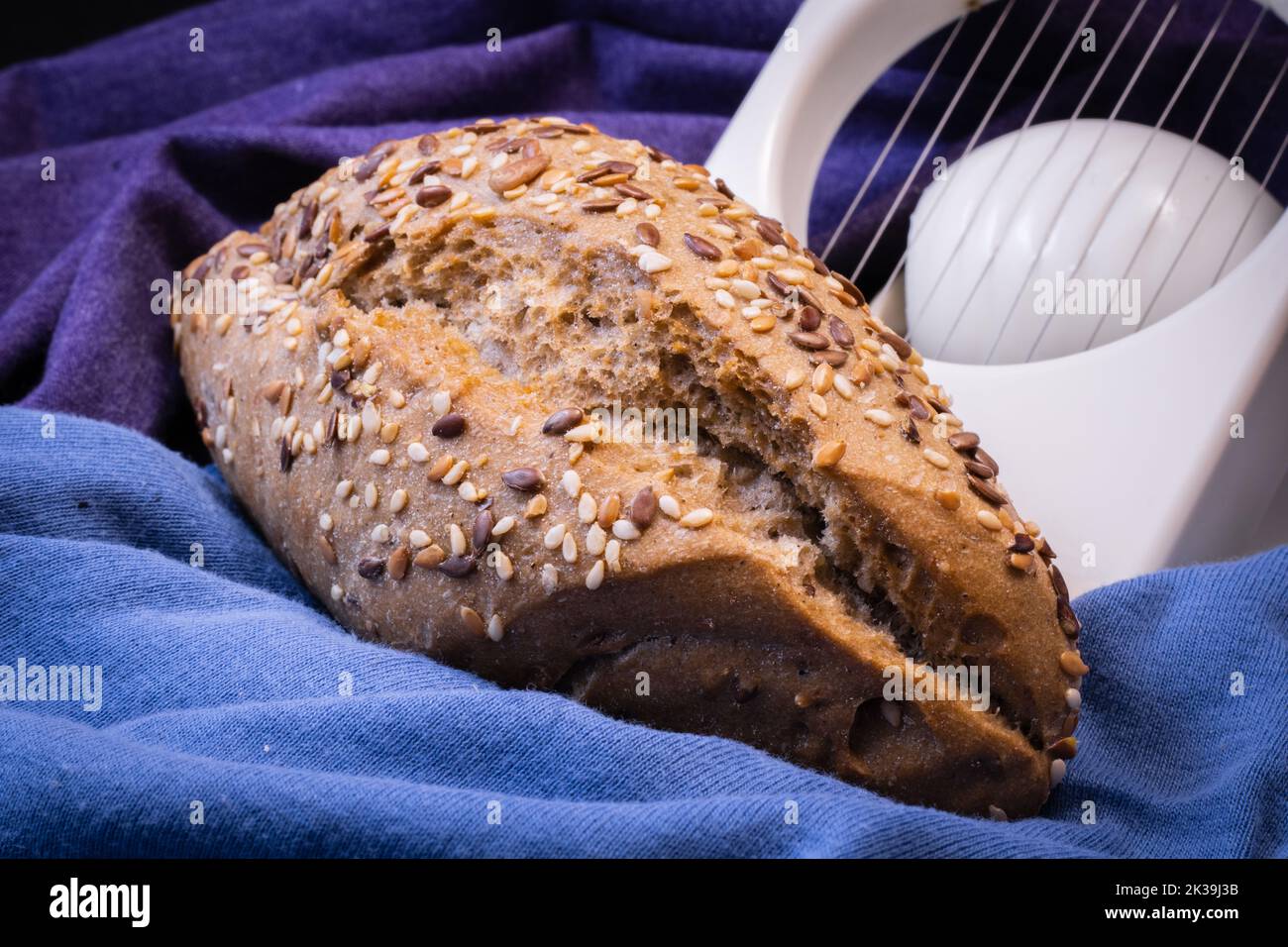rustic bun,salad,pickles,onion and a boiled egg on a blue plate Stock ...