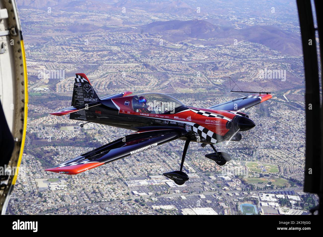 Rob Holland, piloting his MXS-RH, next to the Golden Knights, performs ...