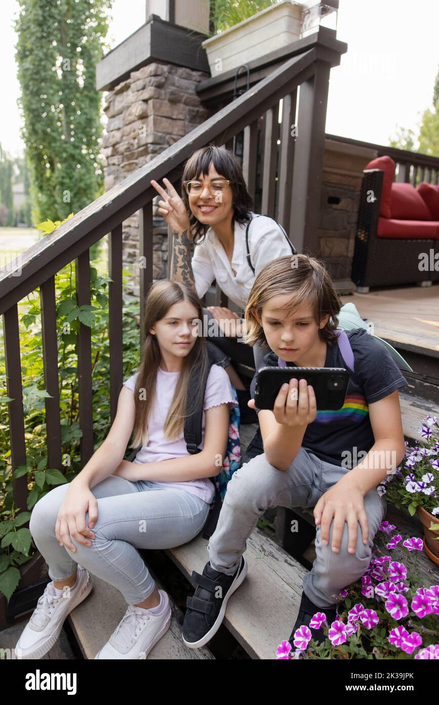 Boy sitting on stoop hi-res stock photography and images - Alamy