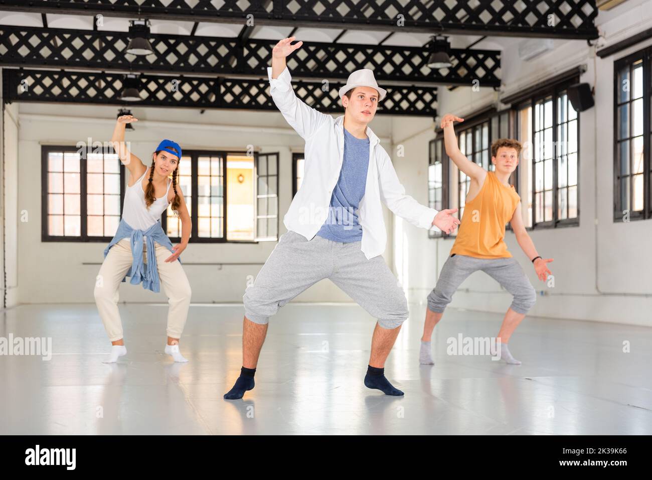 Team of young dancers training moves Stock Photo - Alamy