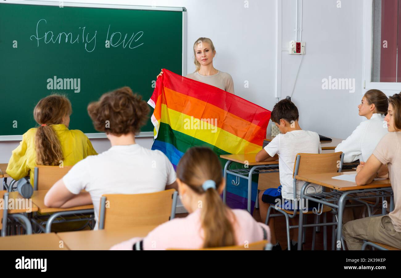 Progressive female teacher discussing with teenage students about LGBT ...