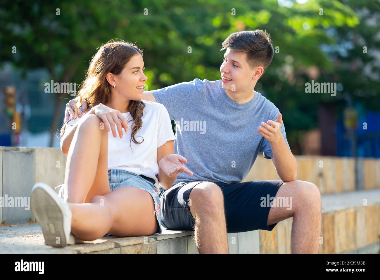 Two teenagers are having a conversation Stock Photo - Alamy