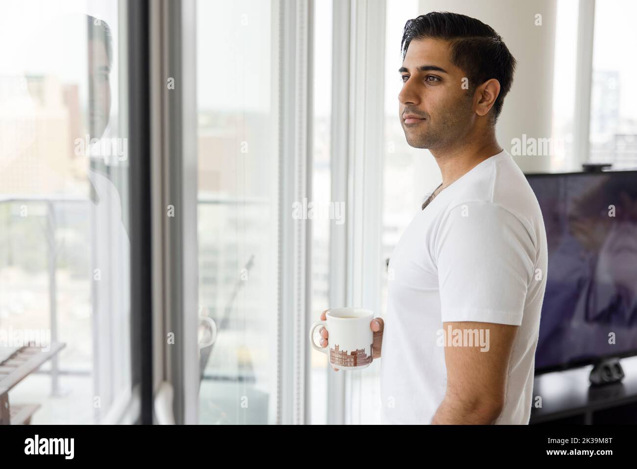 Man through window holding hi-res stock photography and images - Alamy