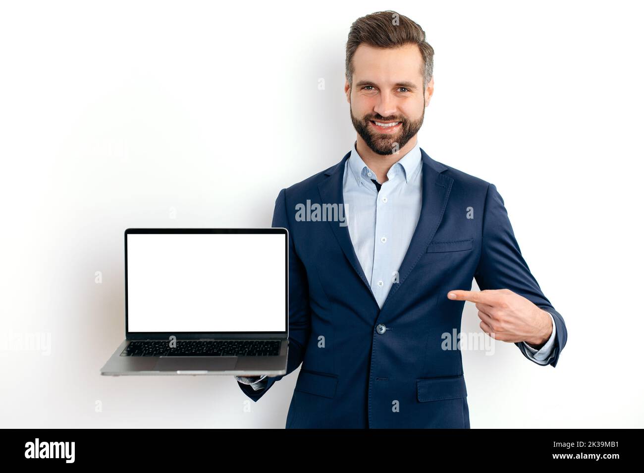 Positive caucasian bearded business man, in a suit, programmer, IT ...