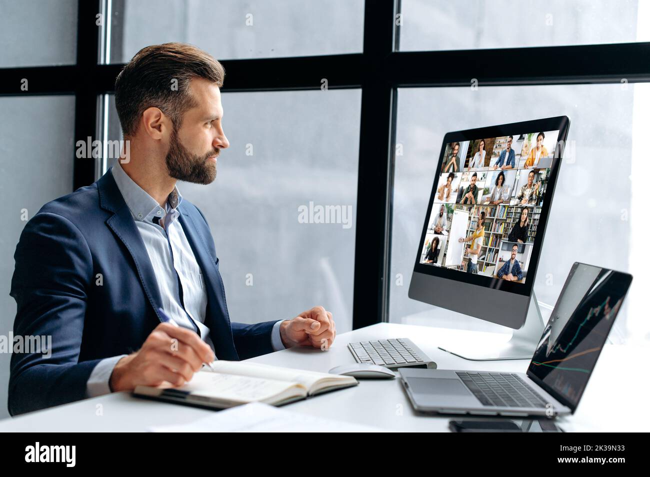 Online virtual meeting. Successful caucasian businessman, sitting in ...