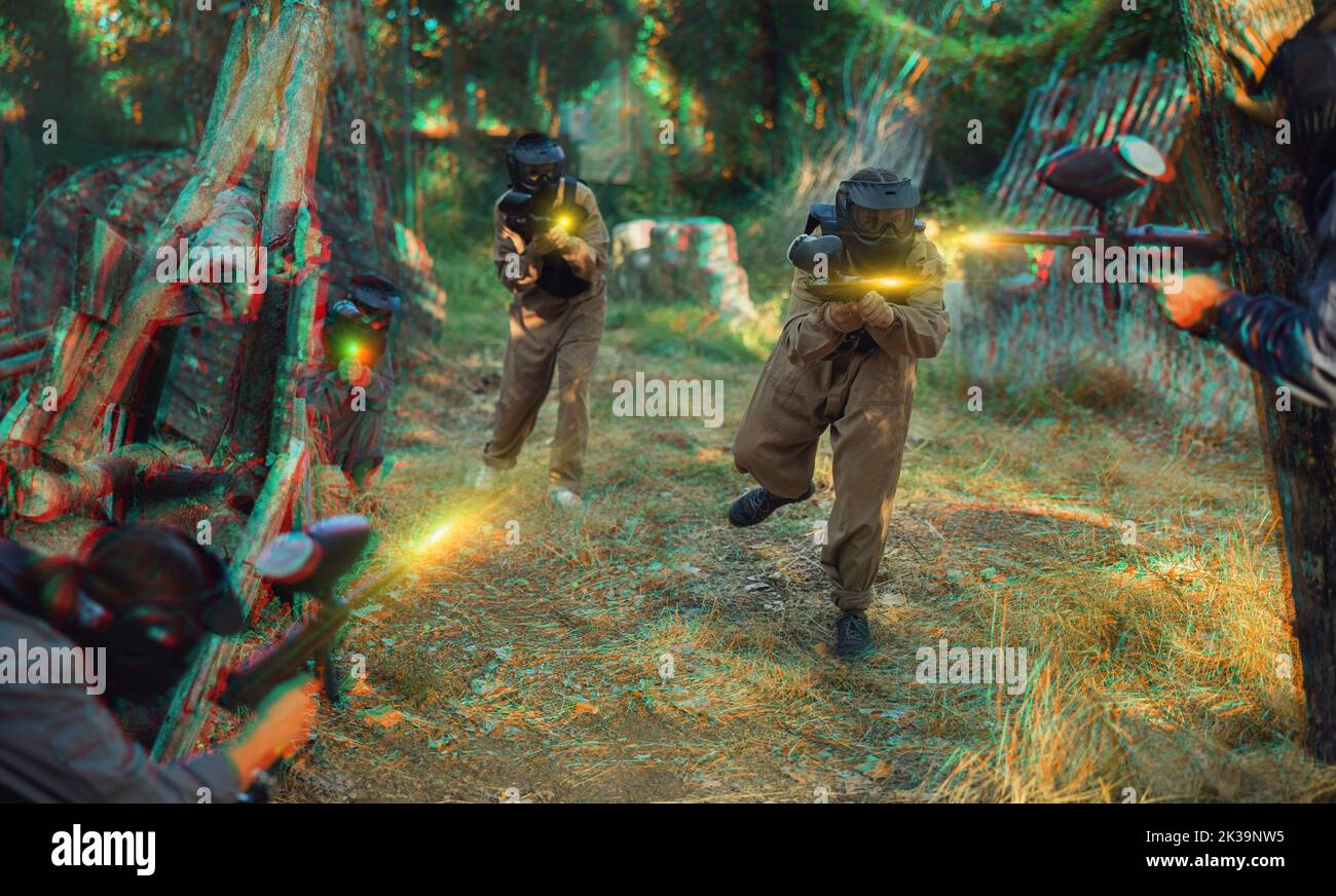 Tactical paintball team fighting on outdoor location Stock Photo - Alamy