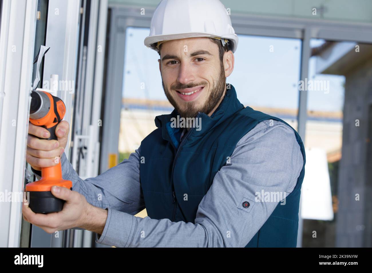 tradesman using cordless drill Stock Photo - Alamy