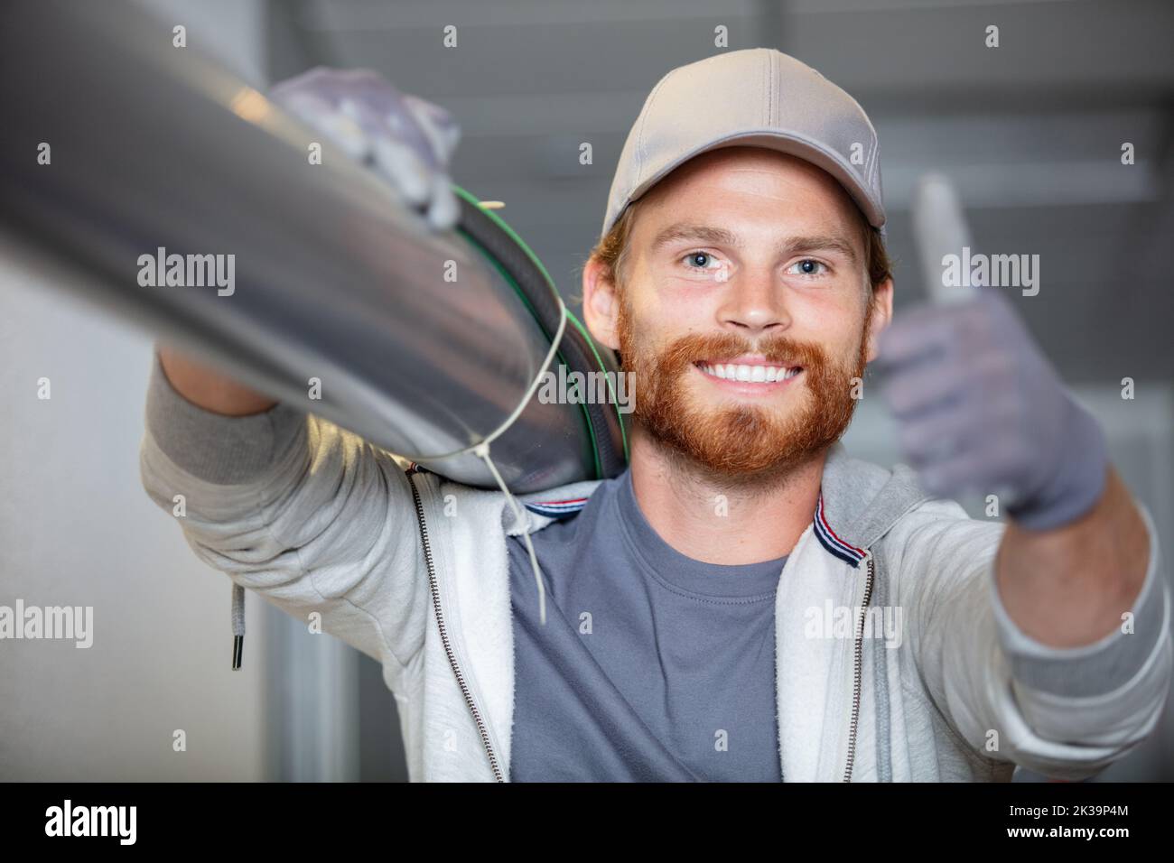 Construction worker carrying pipe hi-res stock photography and images ...