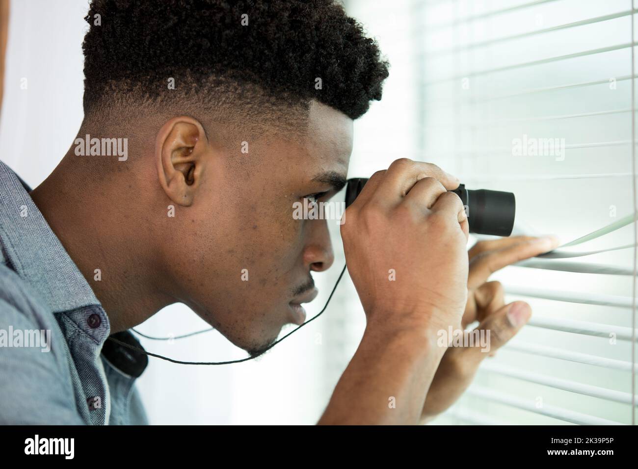 suspicious skeptic and confused man with binoculars Stock Photo - Alamy