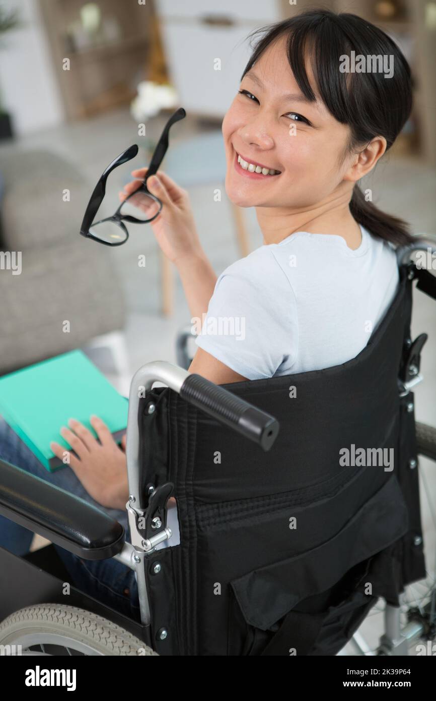 young disabled woman smiling at the camera Stock Photo - Alamy