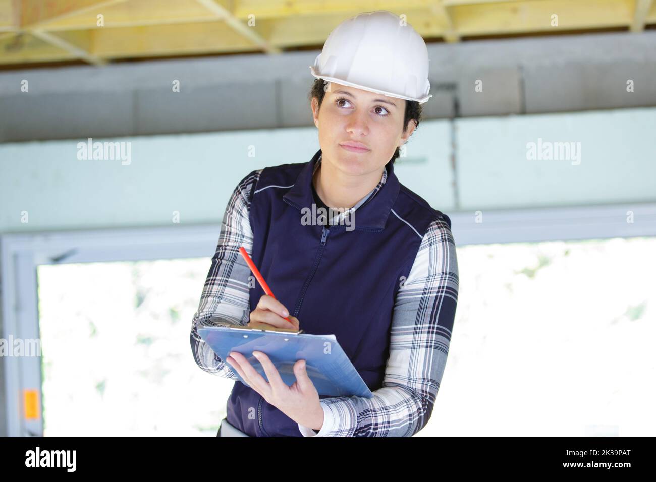 female builder with a clipboard Stock Photo - Alamy