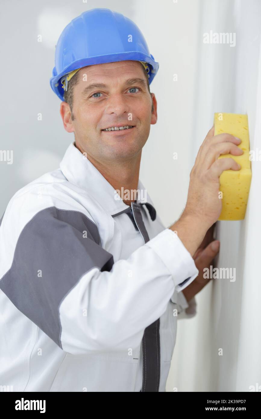 whitewasher man at work before plastering an apartment house Stock ...