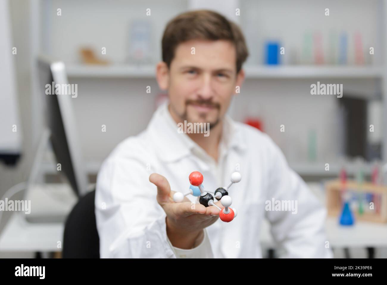 Scientist holding a molecule model hi-res stock photography and images ...