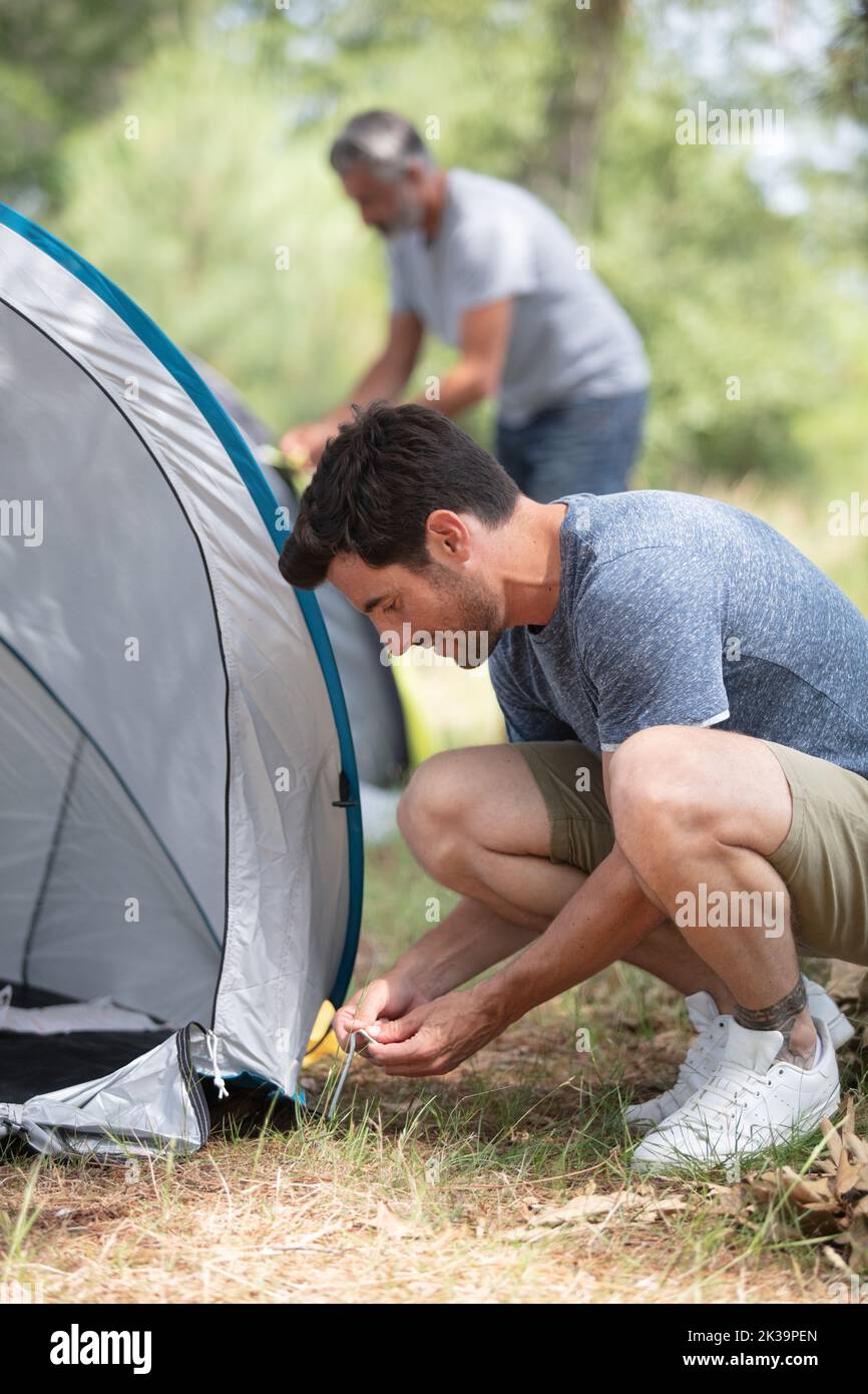 Father setting up tent hi-res stock photography and images - Alamy