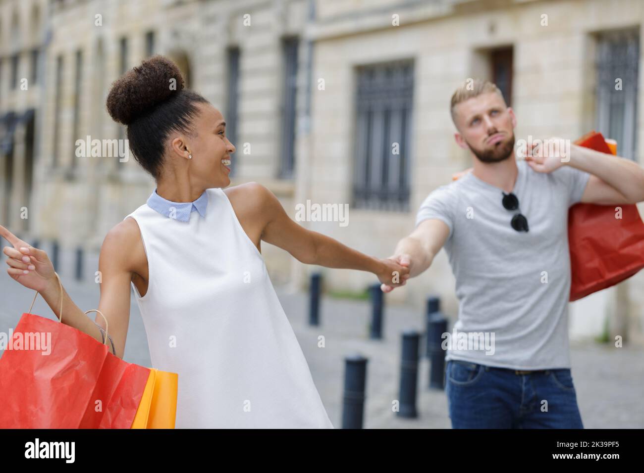 couple doing shopping and sight seeing Stock Photo - Alamy