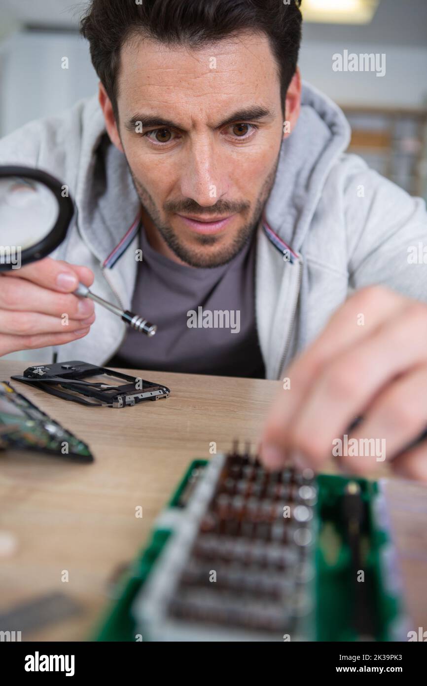 technician working on broken computer in his office Stock Photo - Alamy