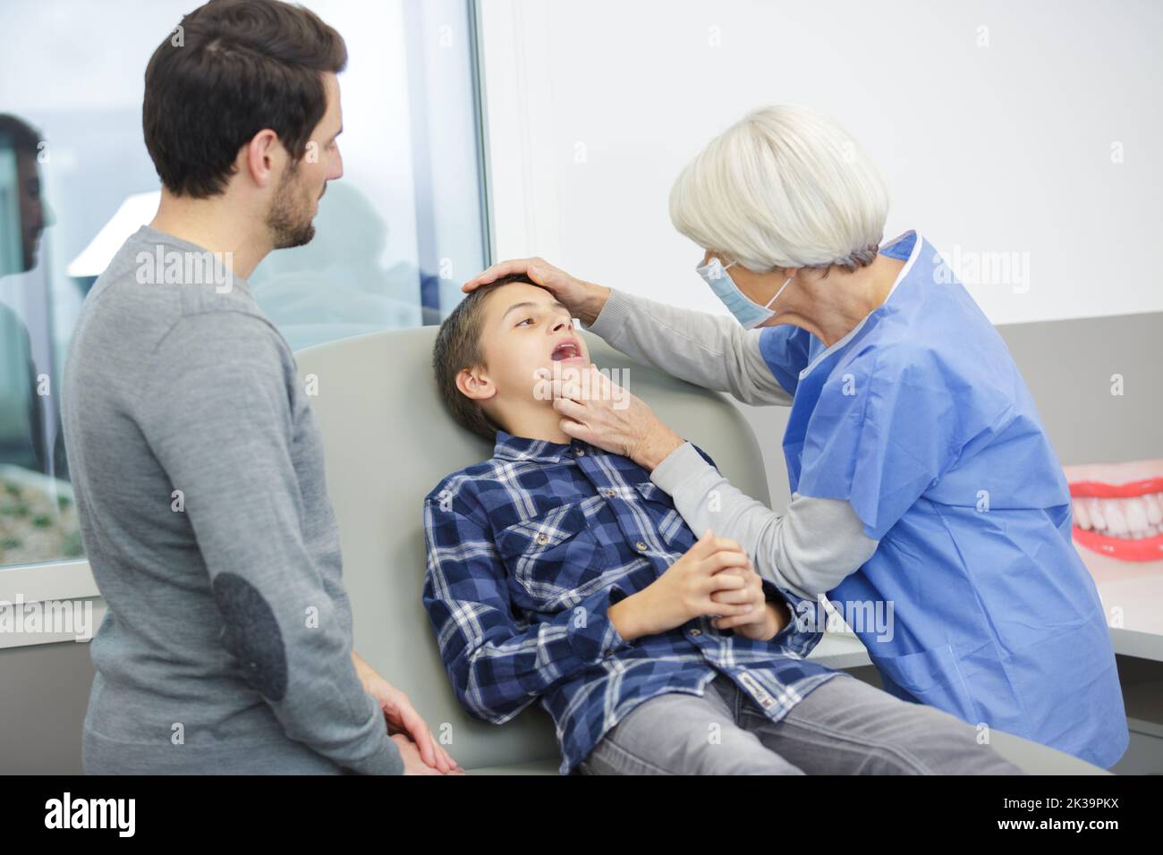 little boy opening mouth during examination Stock Photo - Alamy