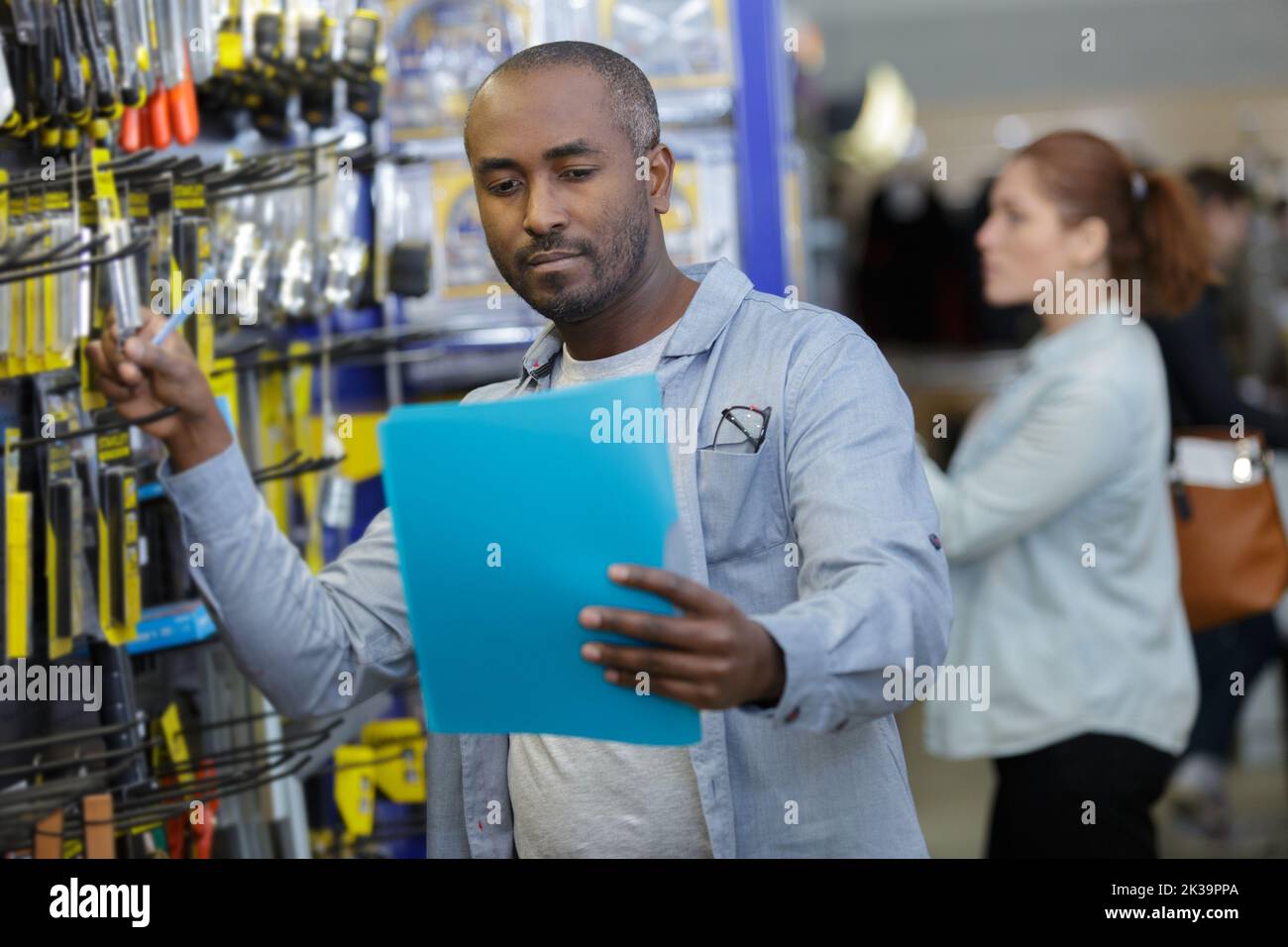 a hardware store salesman worker Stock Photo - Alamy