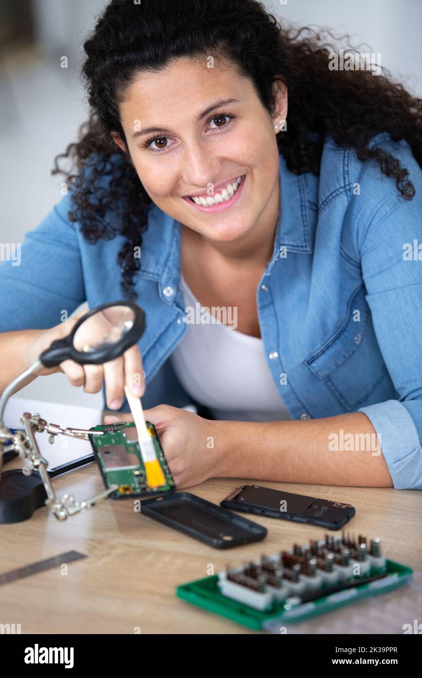 happy female engineer testing circuit board Stock Photo - Alamy