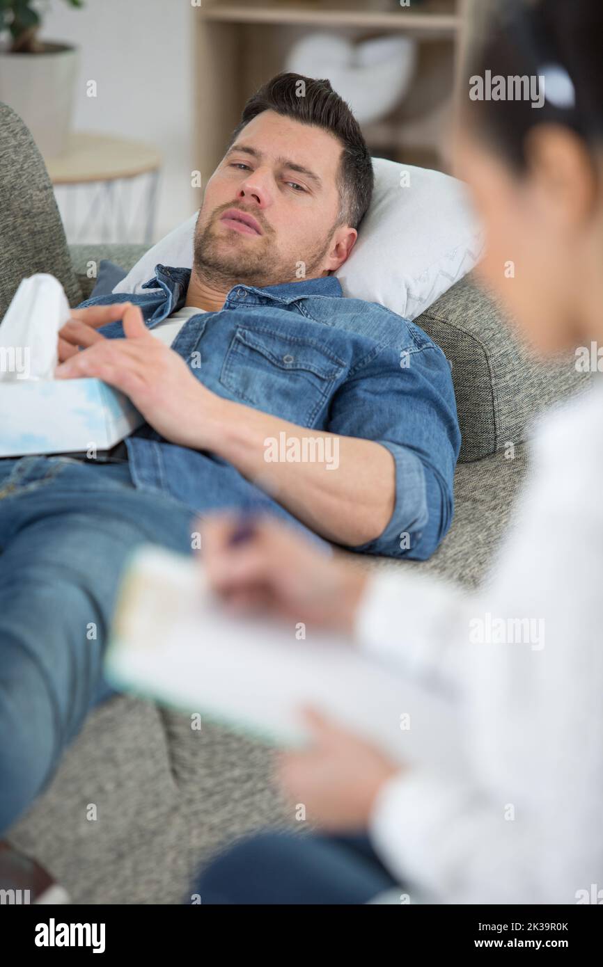 hopeless man at psychiatrists office Stock Photo - Alamy