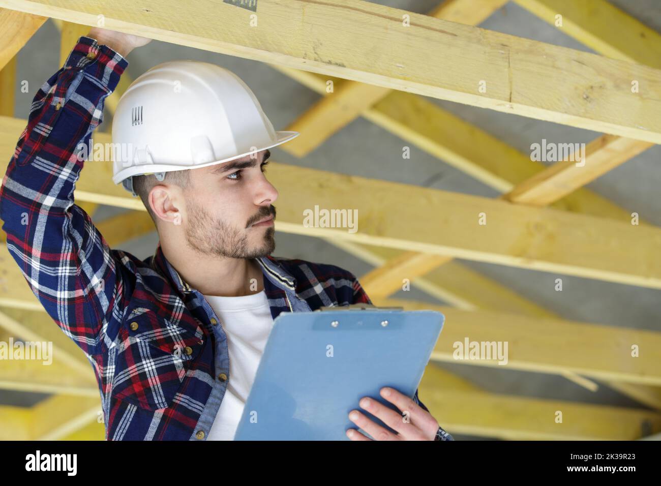 building inspector looking at new property Stock Photo - Alamy