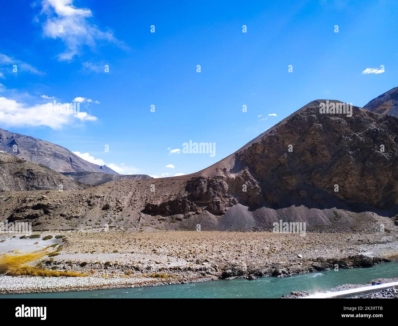 A beautiful shot of a mountain valley beside the Indus River in India ...