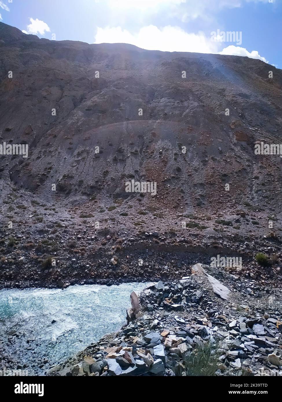 A vertical shot of the Indus River running in a valley in India Stock ...