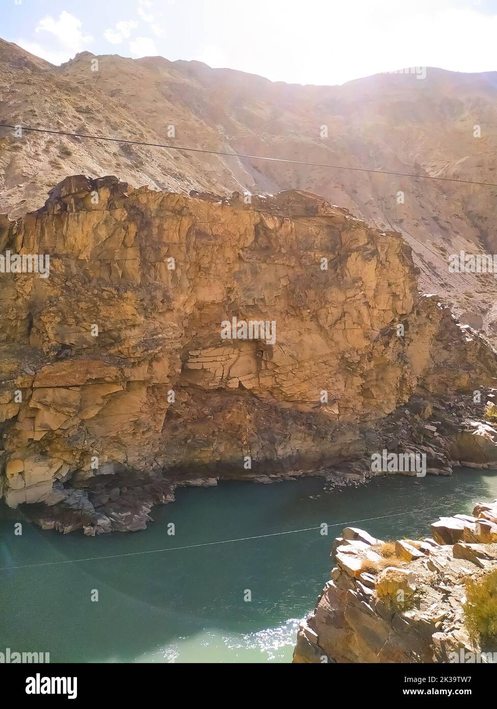 A vertical shot of the Indus River running in a valley in India Stock ...