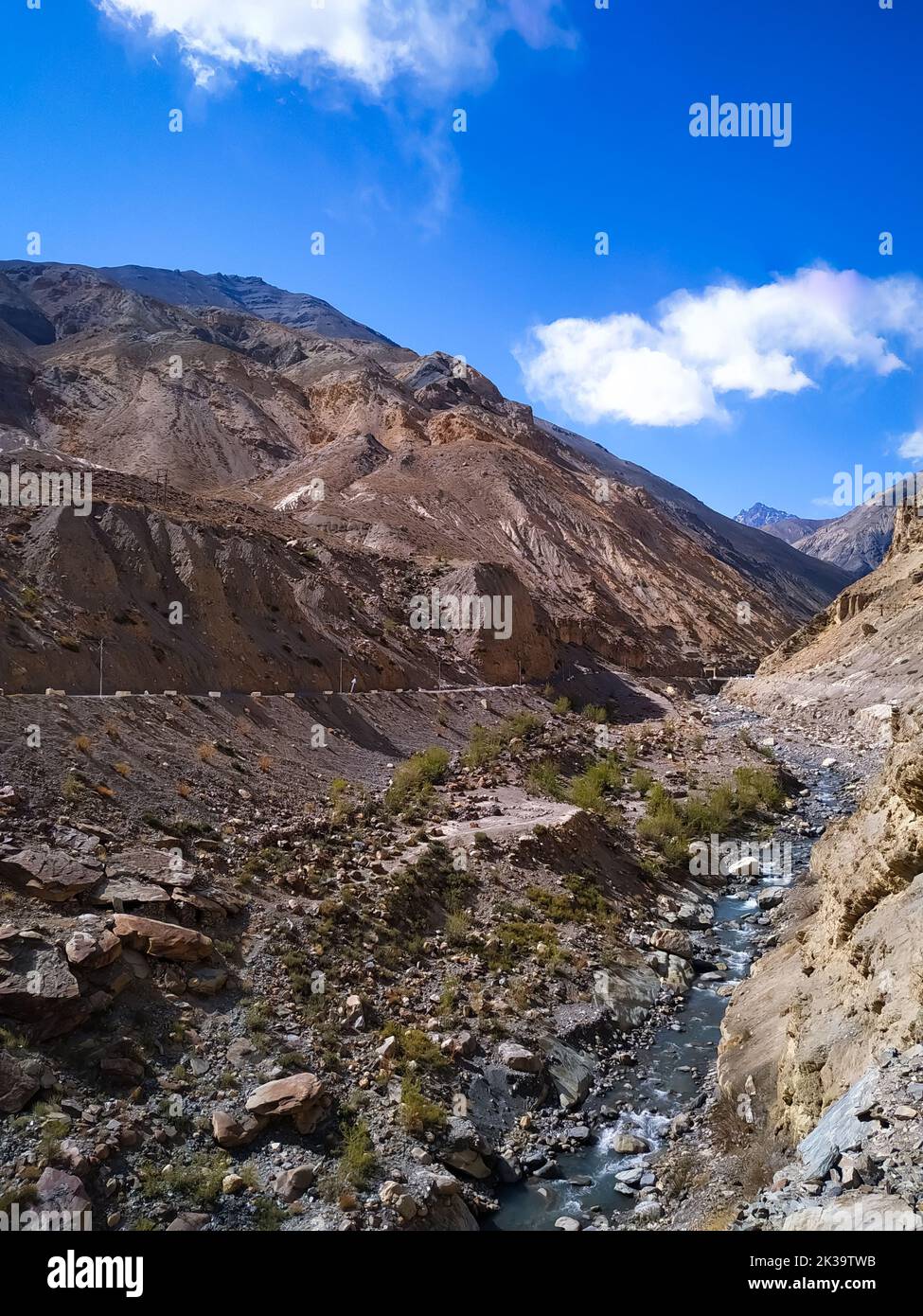 A vertical shot of the Indus River running in a valley in India Stock ...