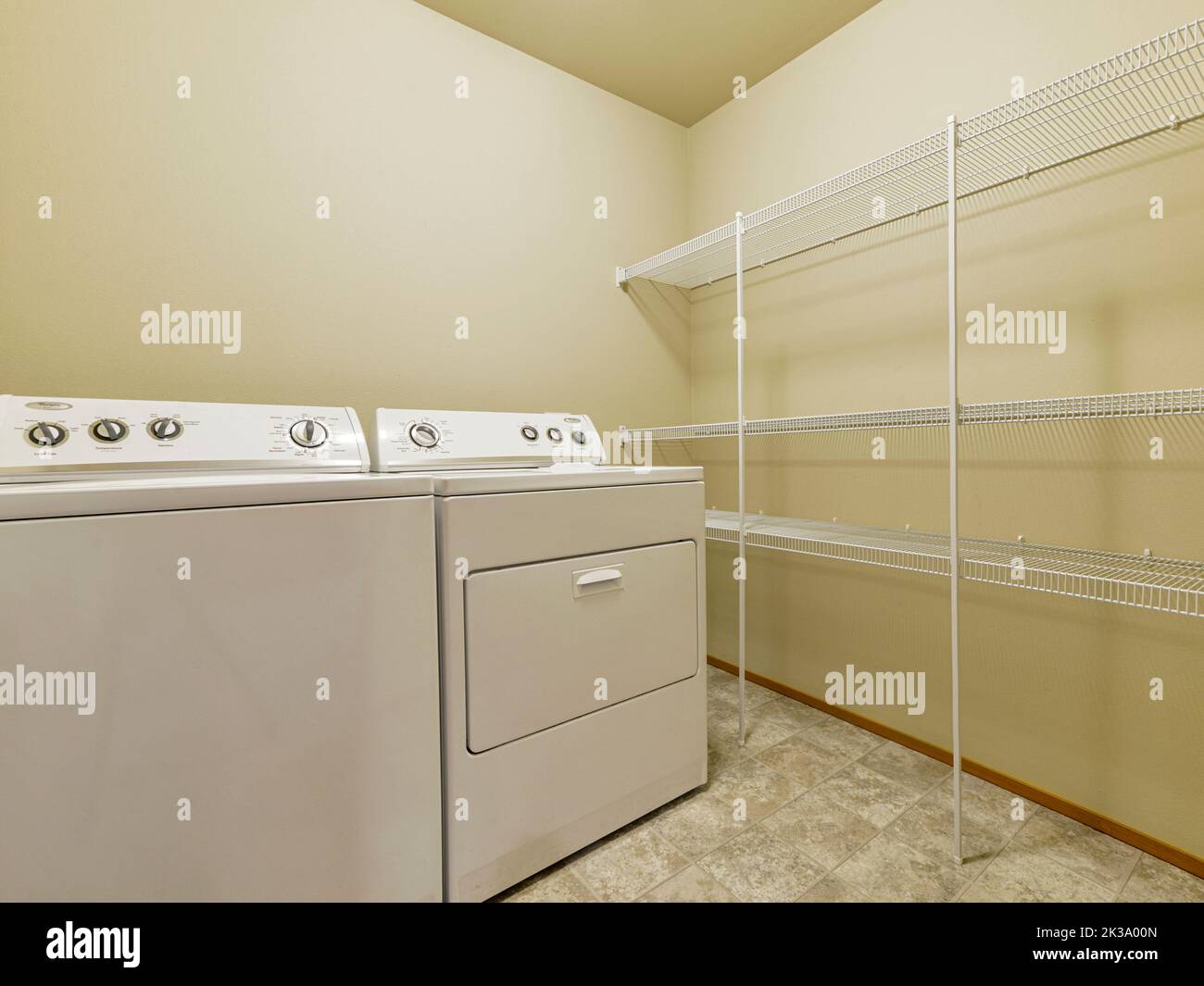 Modern residential laundry room interior Stock Photo - Alamy