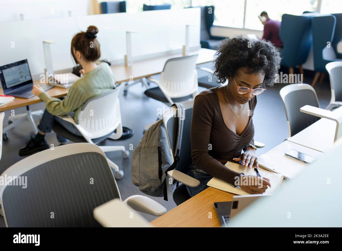 Female student studying library hi-res stock photography and images - Alamy