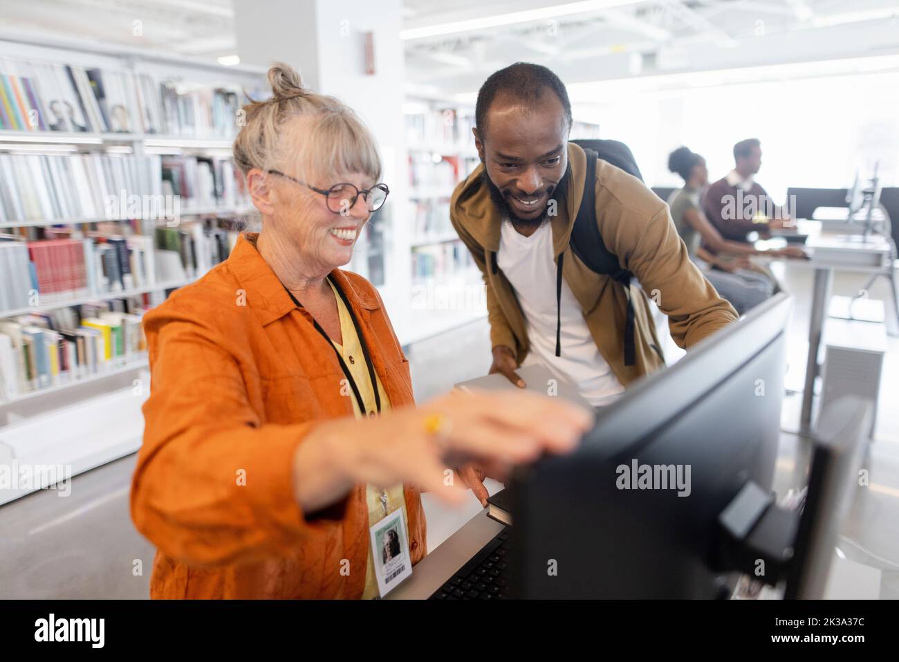 Student librarian talking hi-res stock photography and images - Alamy
