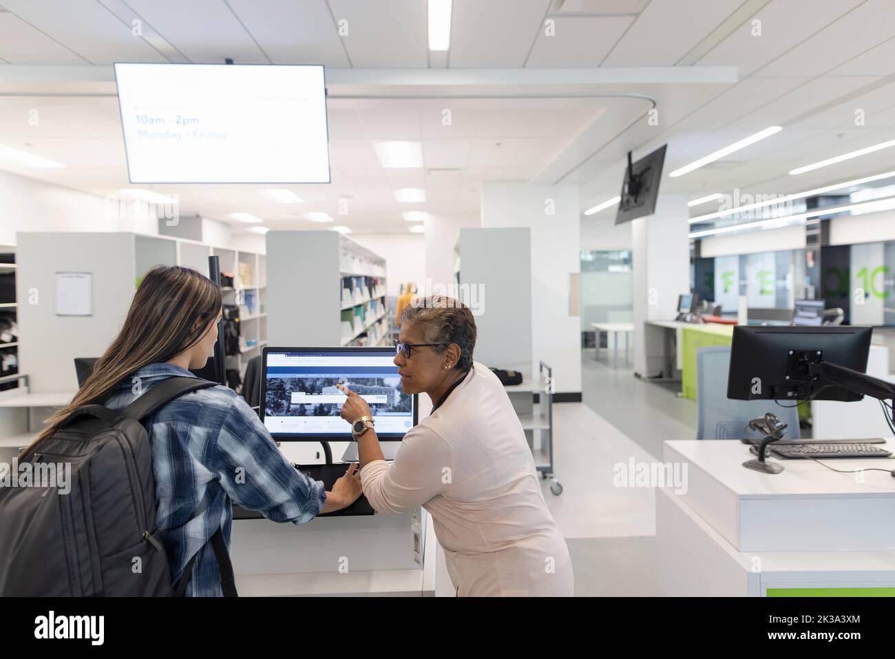 Student librarian talking hi-res stock photography and images - Alamy