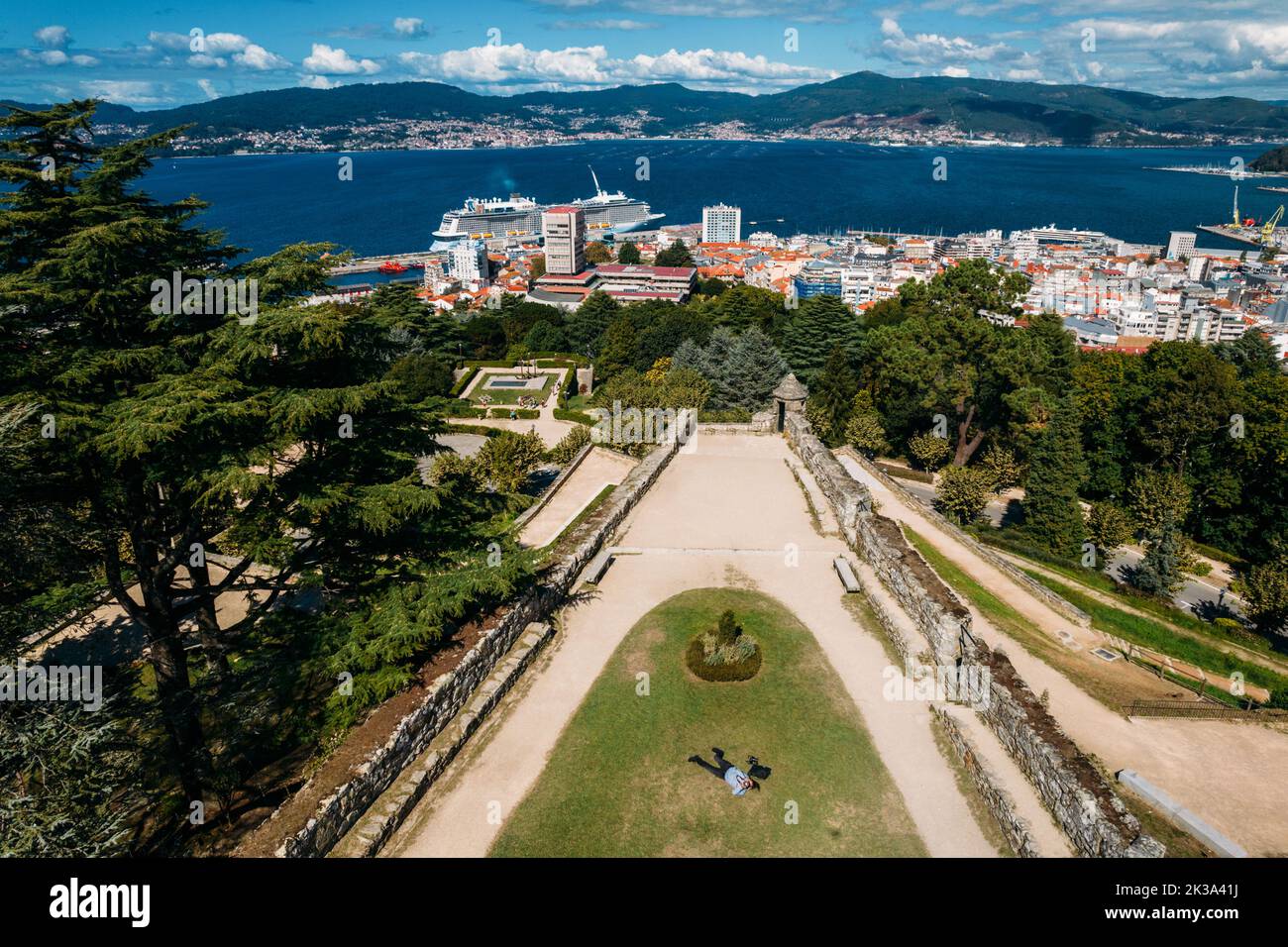 Drone aerial top down view of tourists at Monte do Castro park in Vigo ...