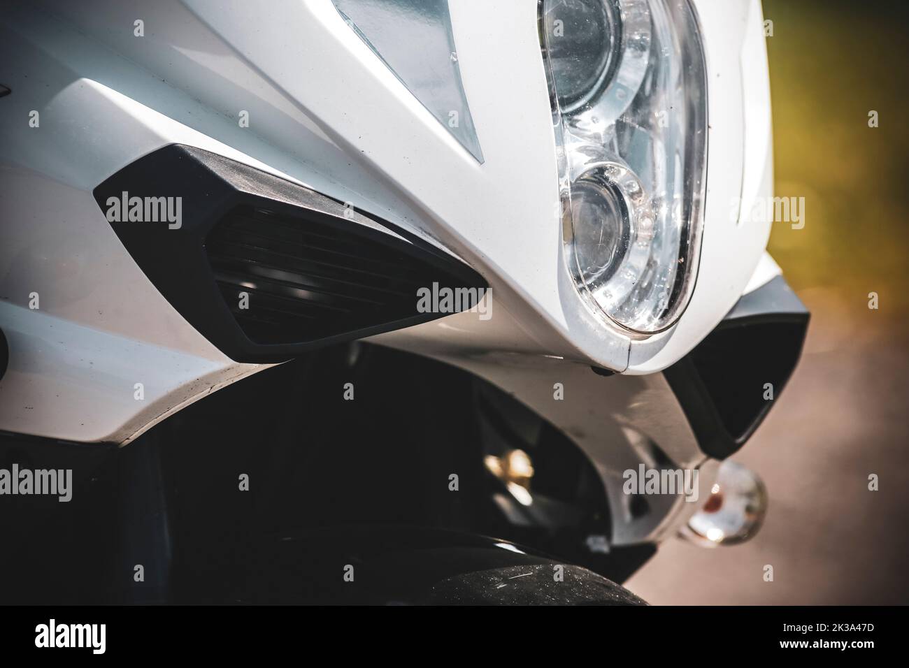 air intakes and dome of the front headlight of a sports motorcycle ...