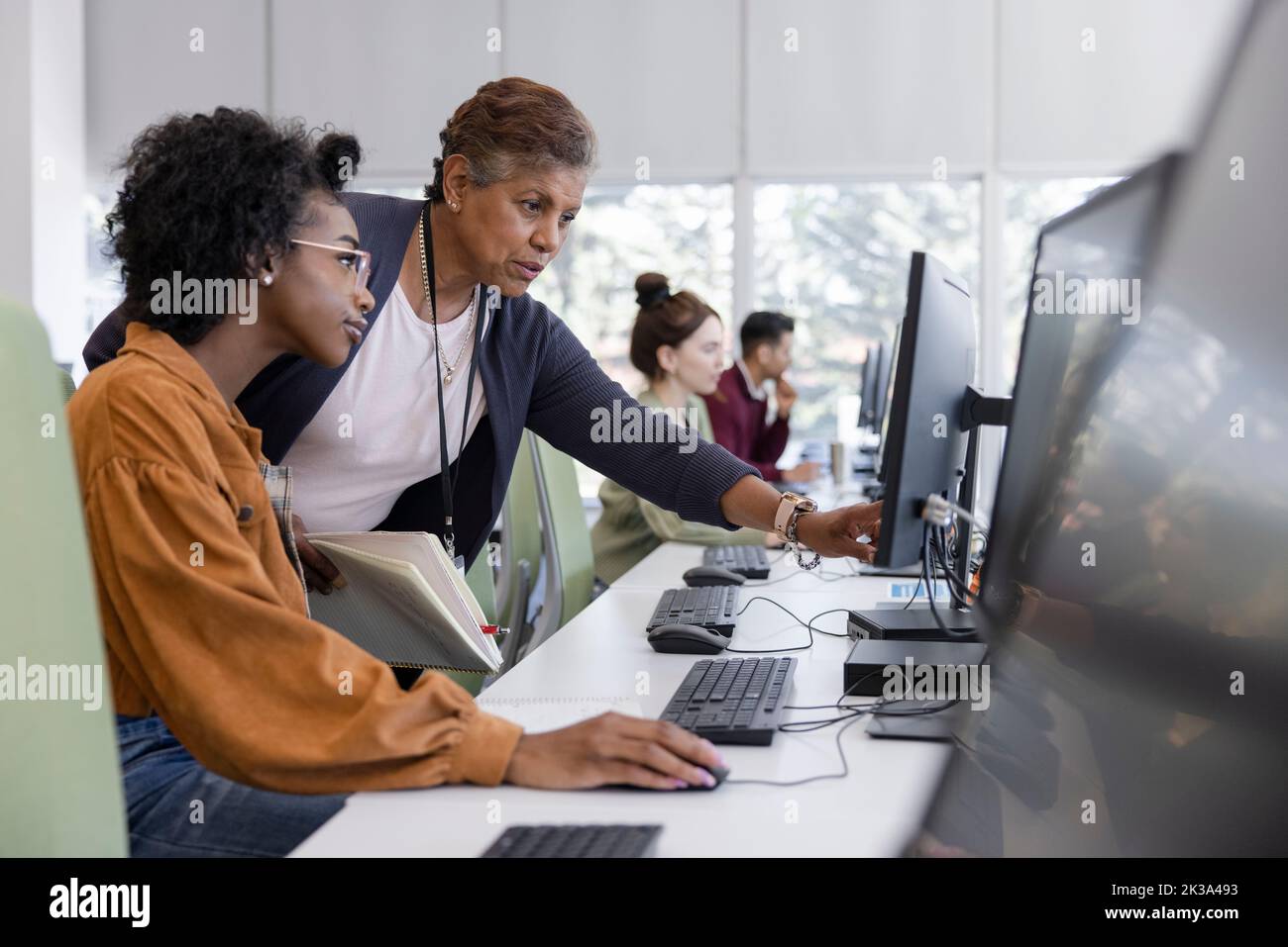 Student librarian talking hi-res stock photography and images - Alamy