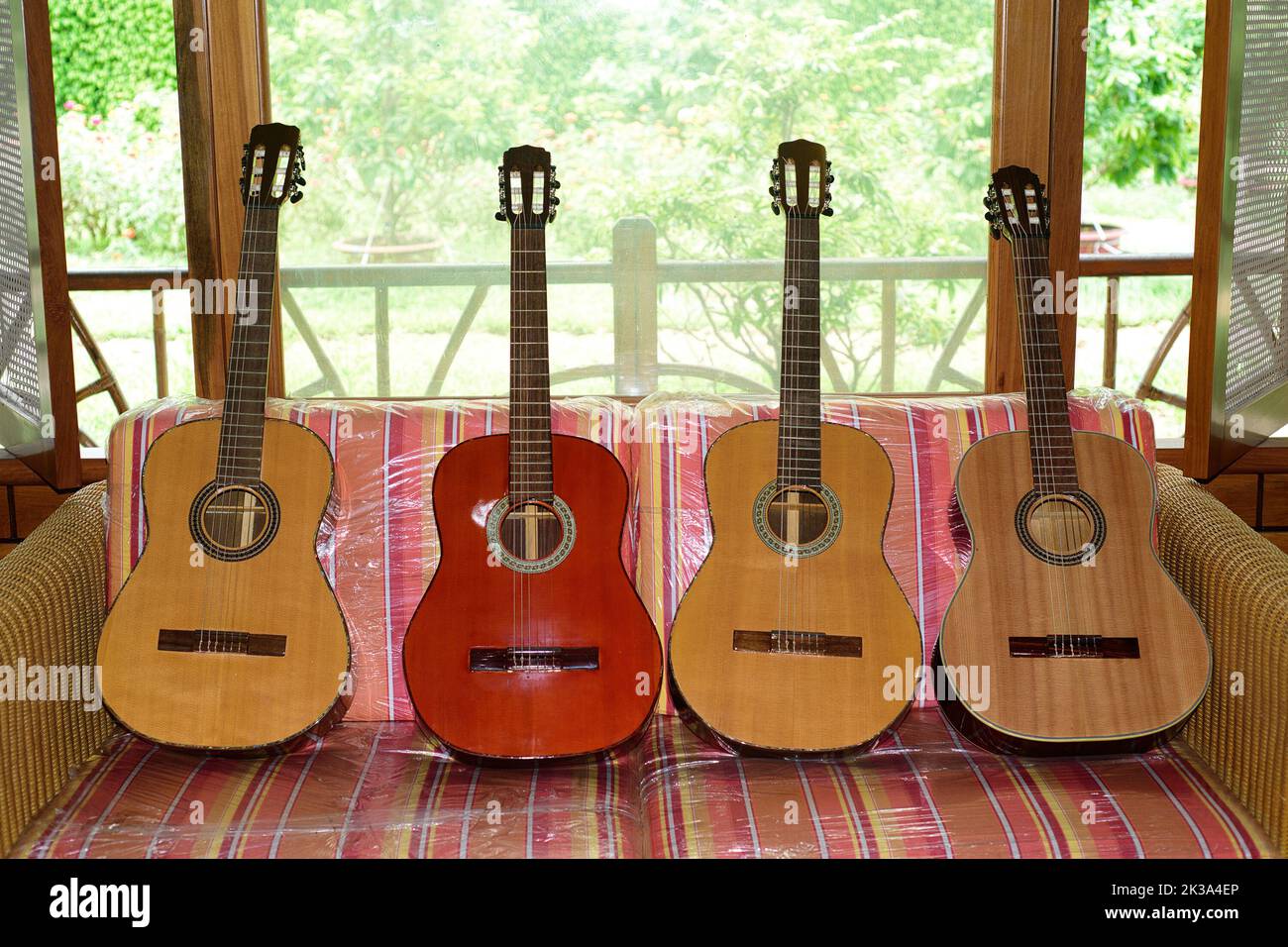 Many finished wooden guitars in workshop Stock Photo - Alamy
