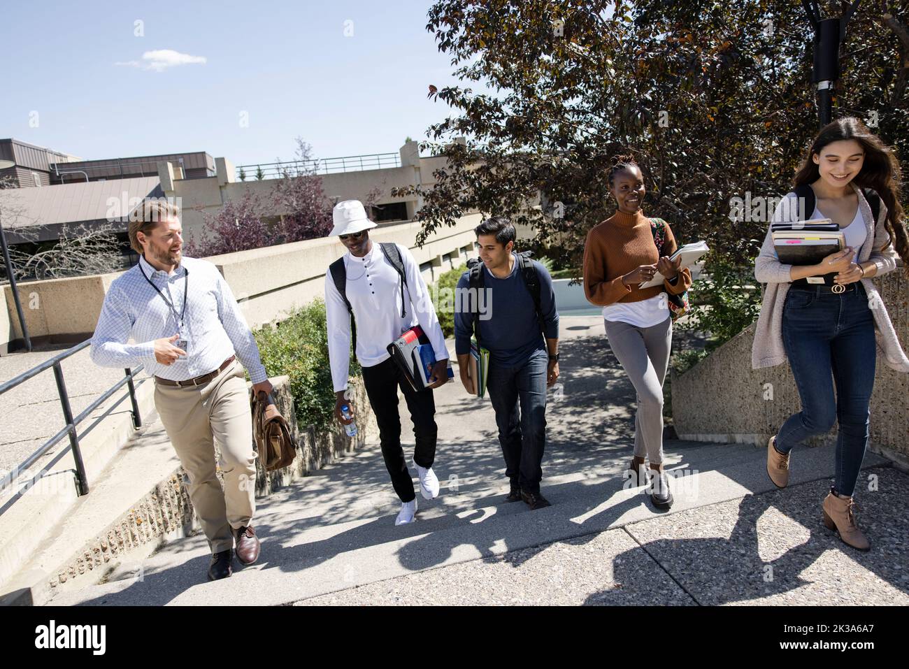 Man walking up steps hi-res stock photography and images - Alamy