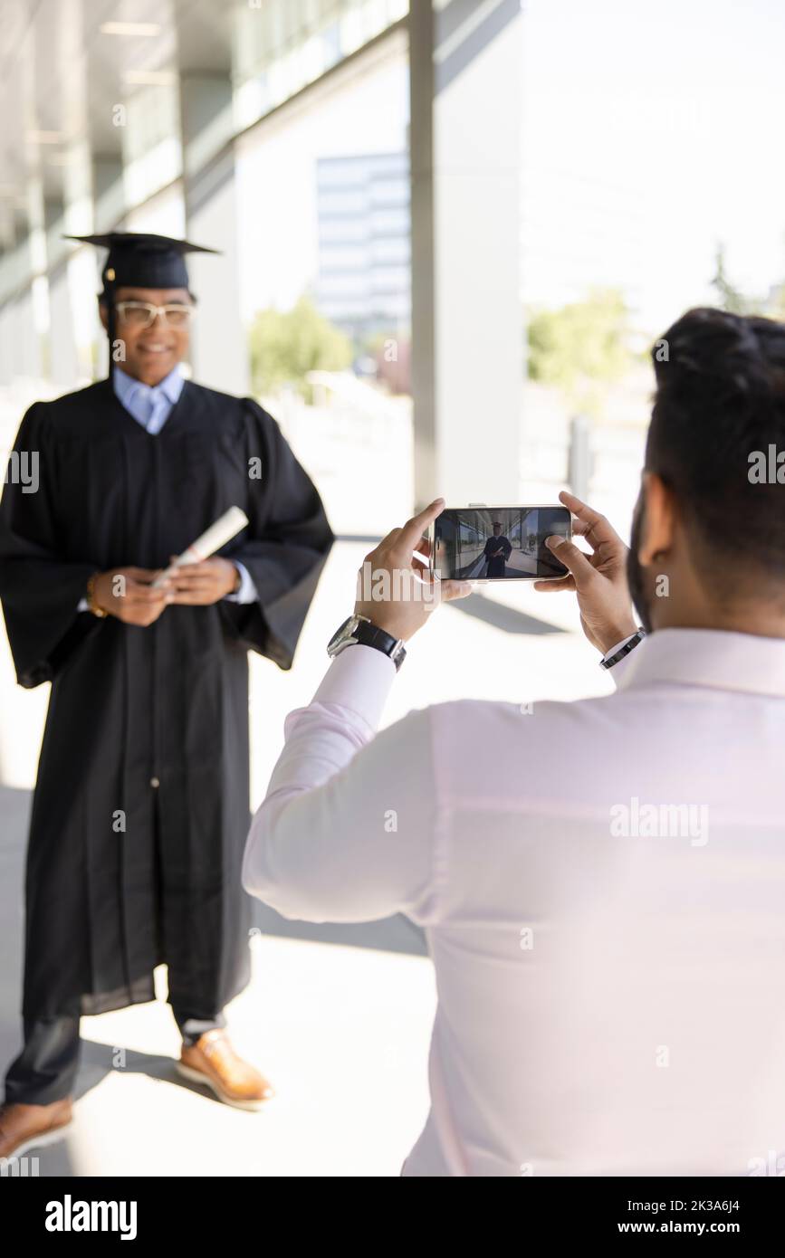 Male college graduate posing outdoors hi-res stock photography and ...