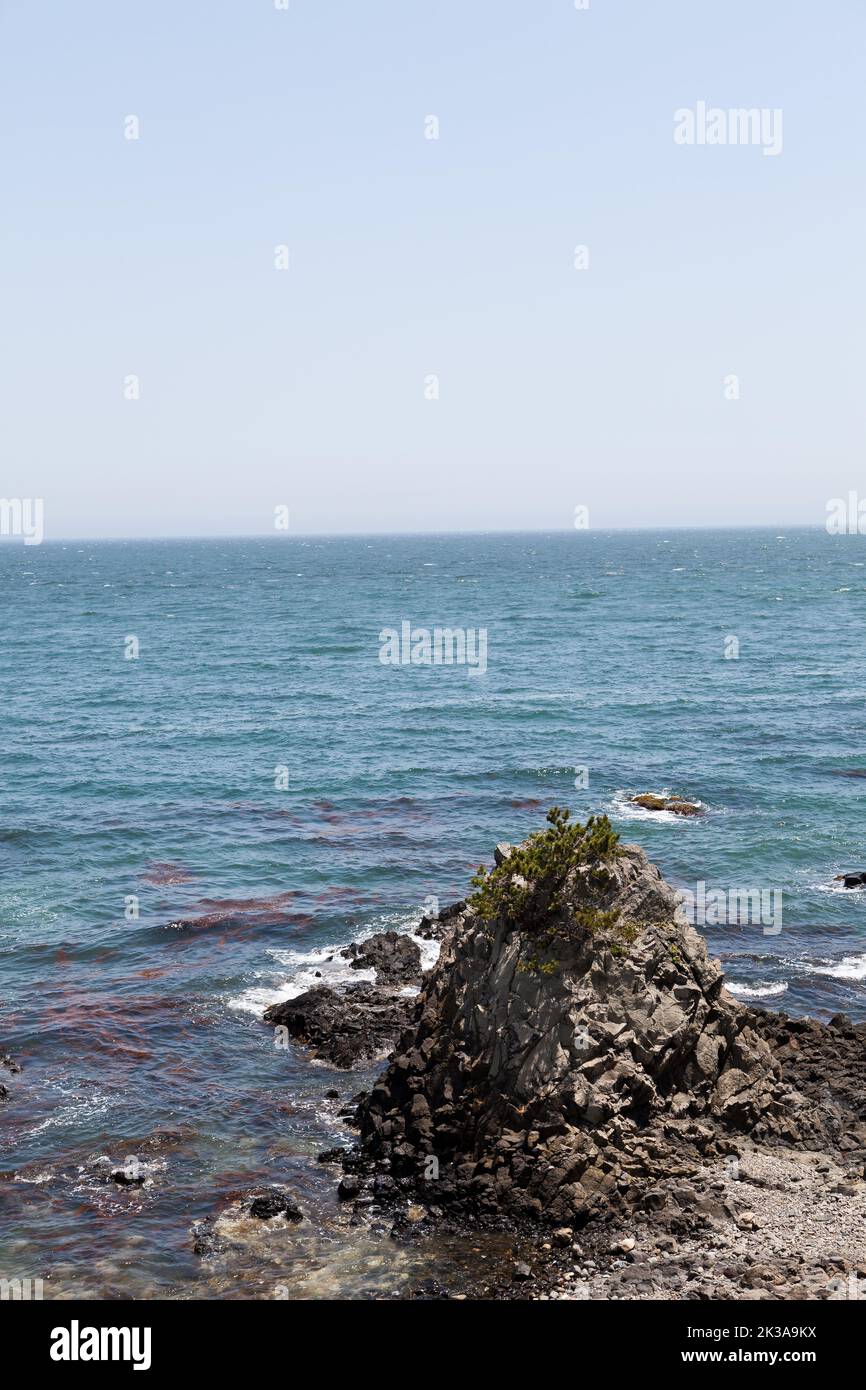 Lying columnar joints and waves harmonize with the landscape Stock ...