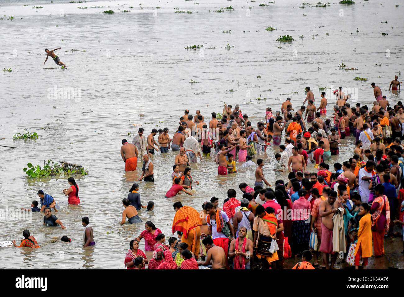 Devotees seen in River Ganges during the Mahalaya celebration. Mahalaya ...