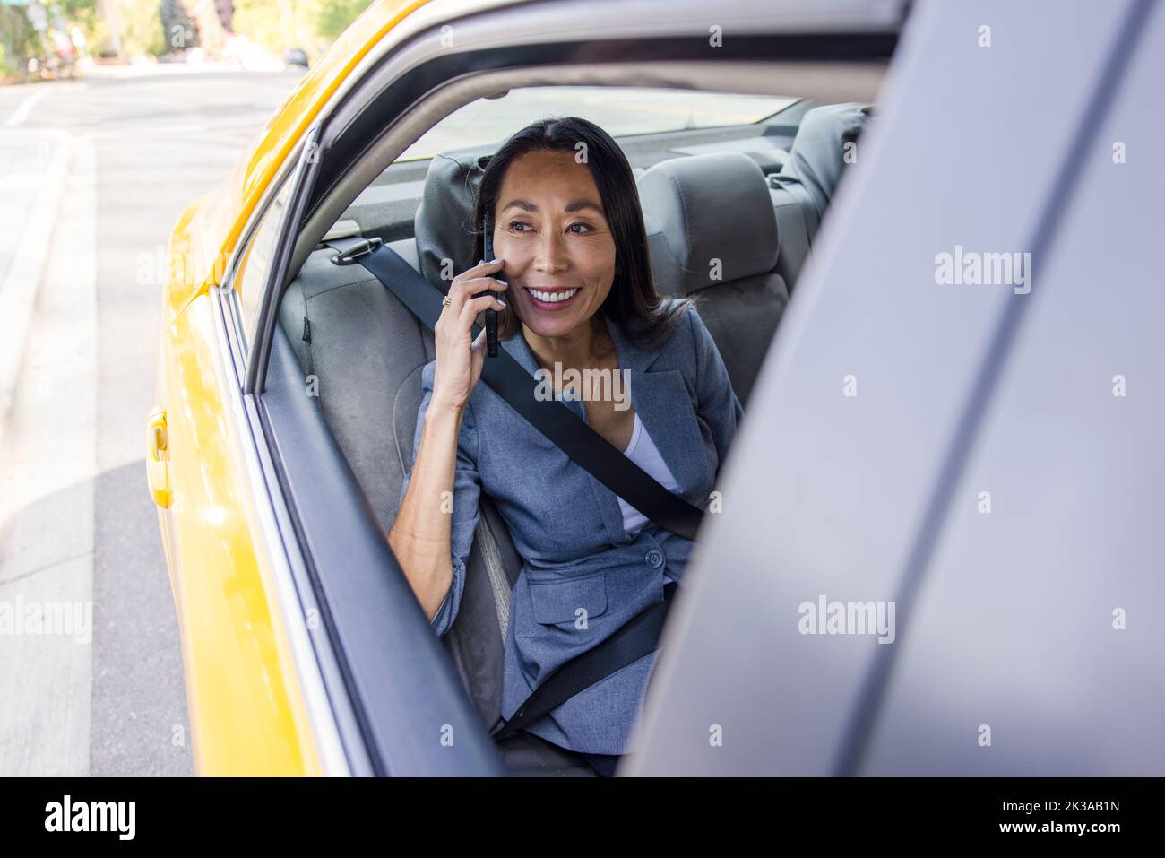 Person riding in yellow taxi hi-res stock photography and images - Alamy
