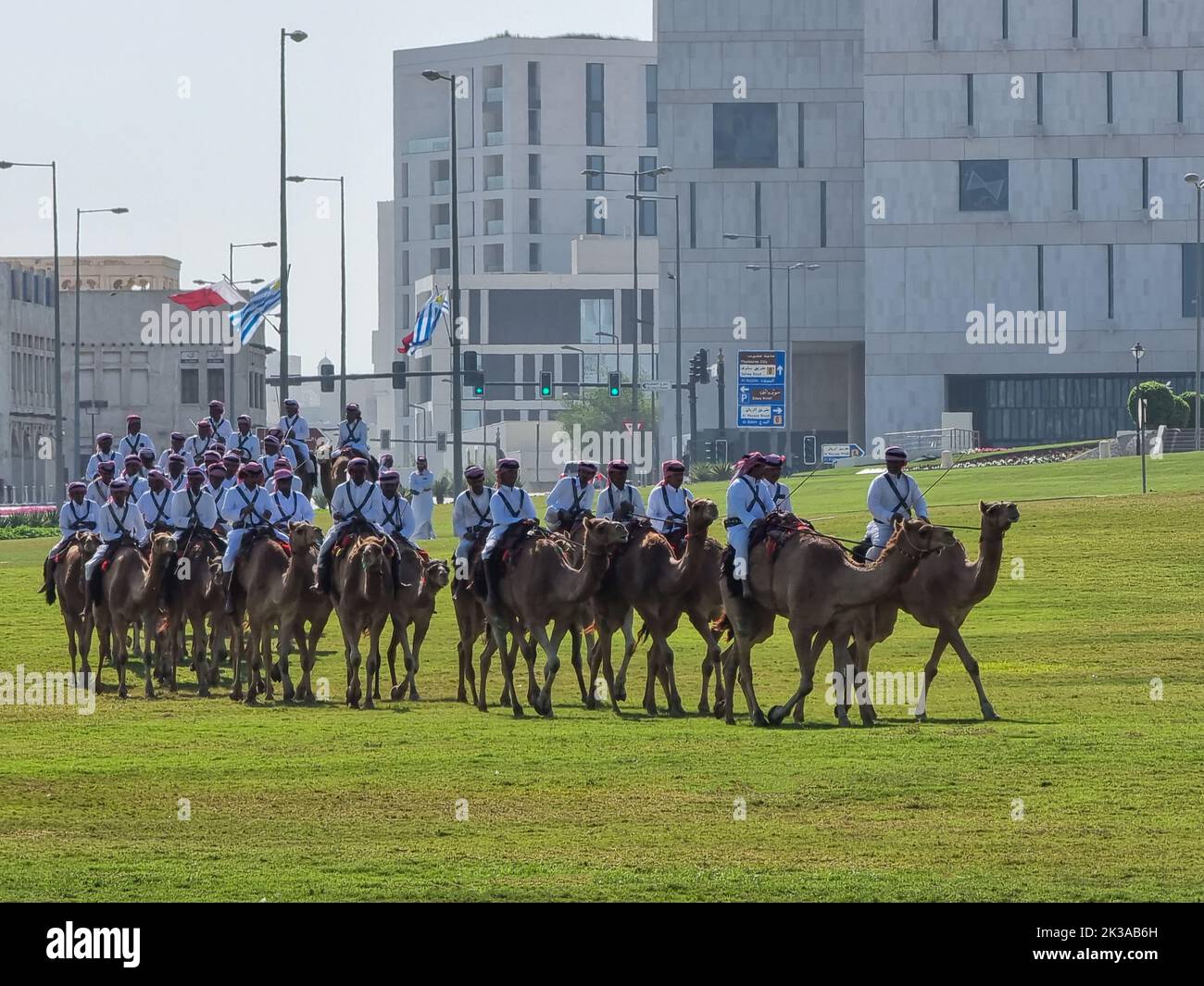 Police on camel in traditional clothes in Doha, Qatar. Doha has a ...