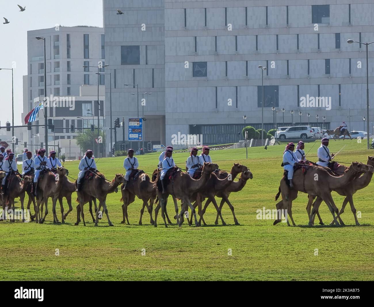 Police on camel in traditional clothes in Doha, Qatar. Doha has a ...