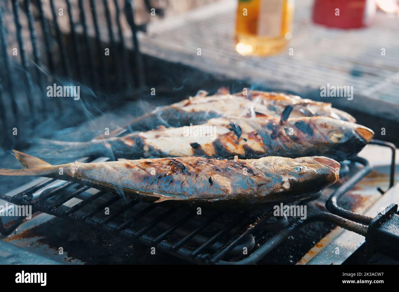 Closeup of grilled fish on gridiron Stock Photo - Alamy