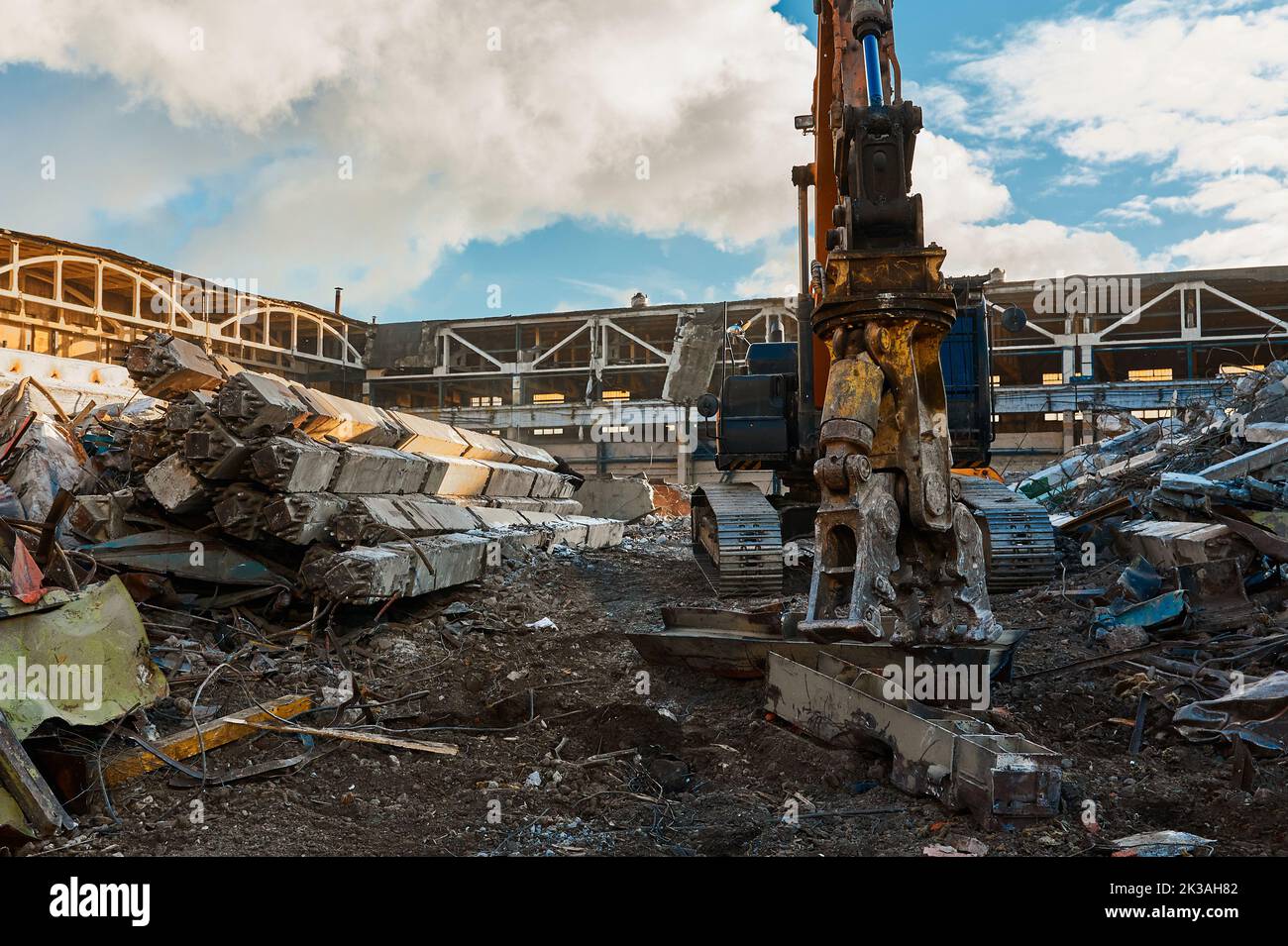Excavator destroyer removes debris winter day Stock Photo - Alamy