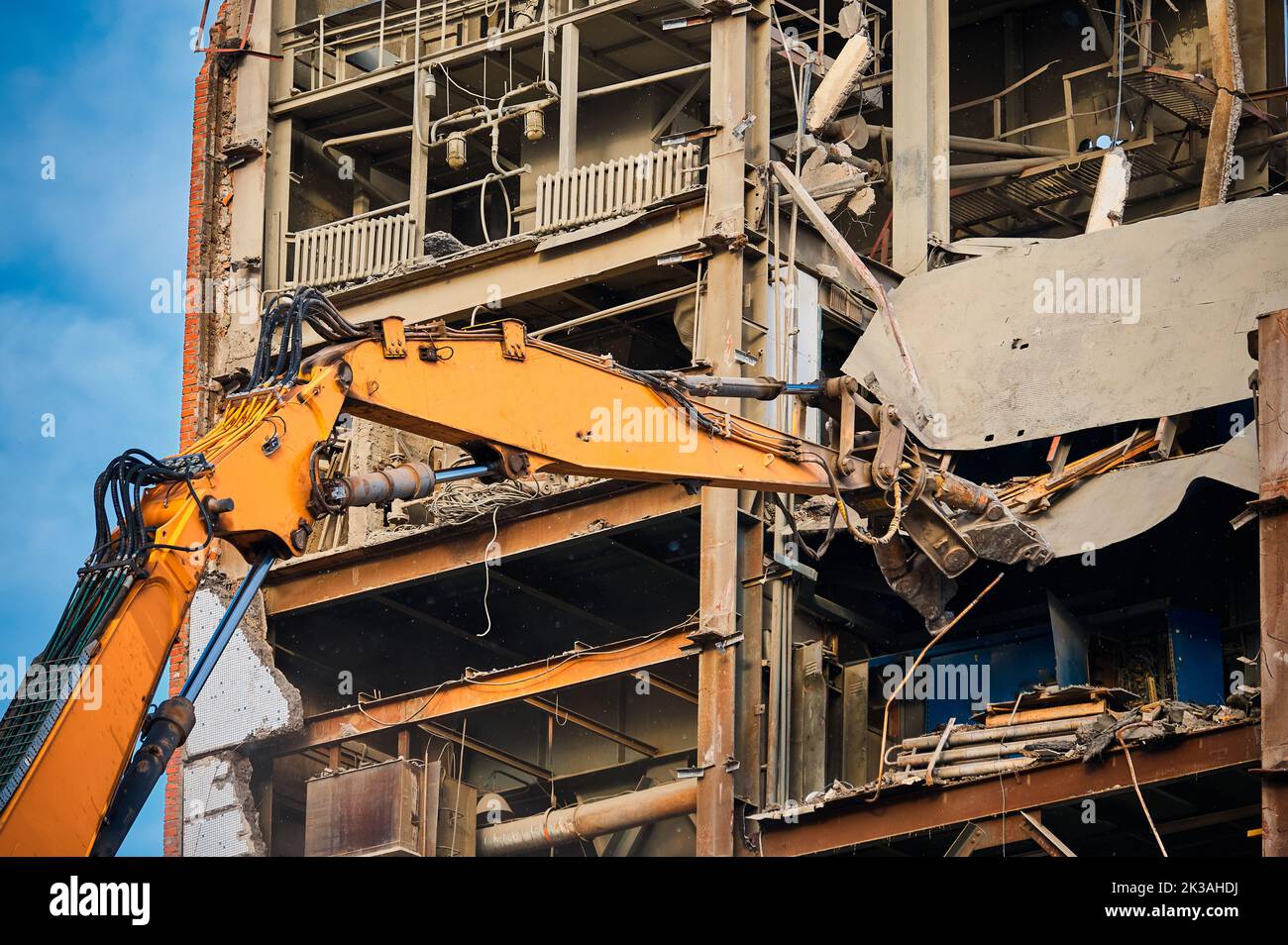 Destroying of old industrial building by excavator destroyer Stock ...