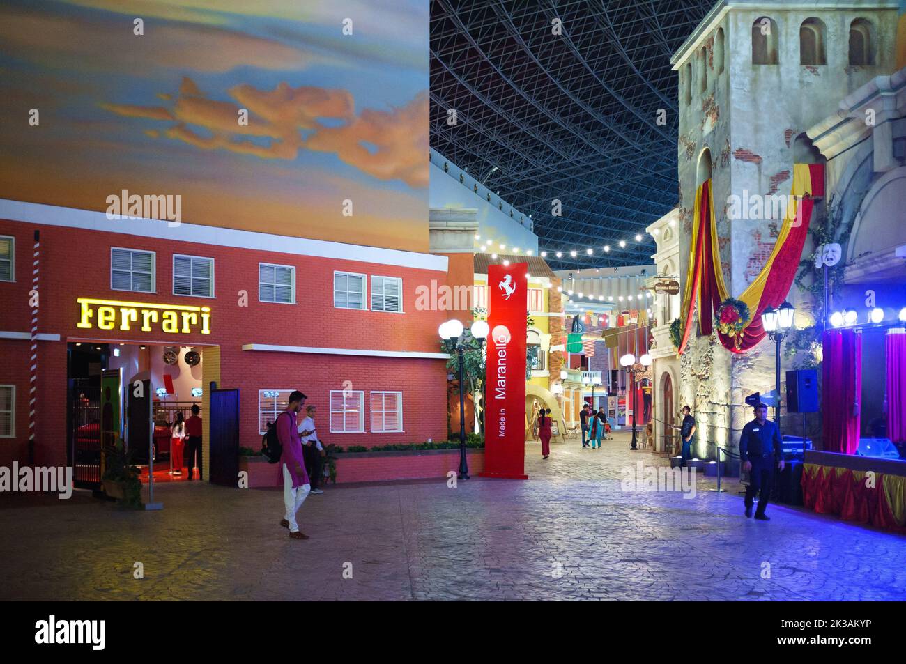An indoor street with various shops in the Ferrari World Amusement Park ...