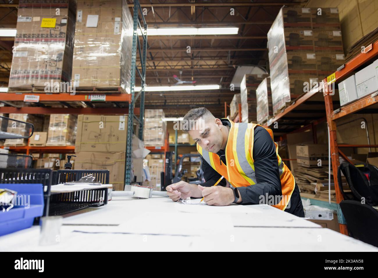 Preparing paperwork in distribution warehouse hi-res stock photography ...